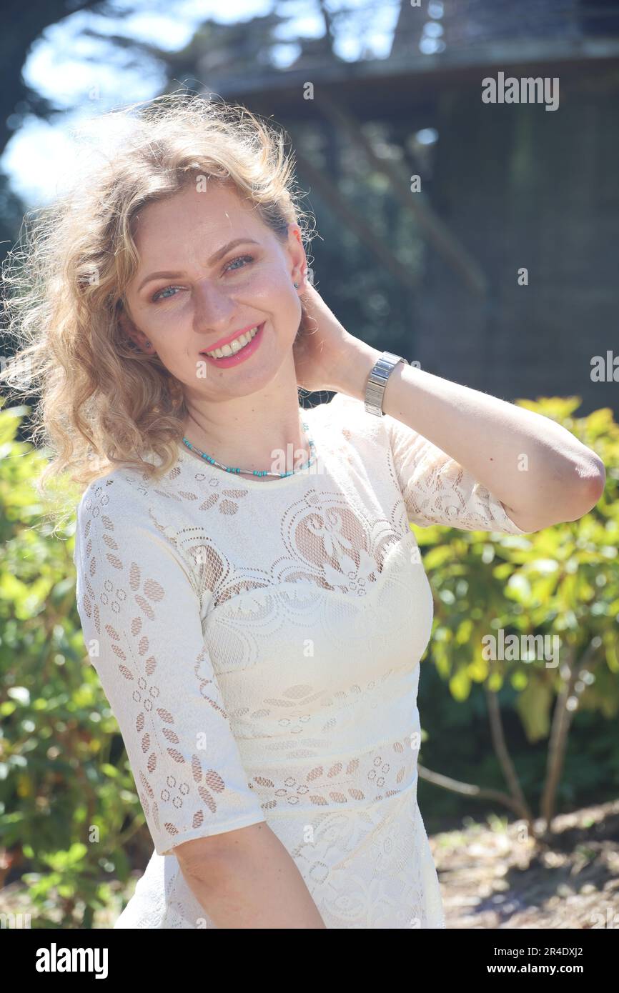 Photo of a Beautiful Russian Lady in a tulip garden by a windmill Stock ...