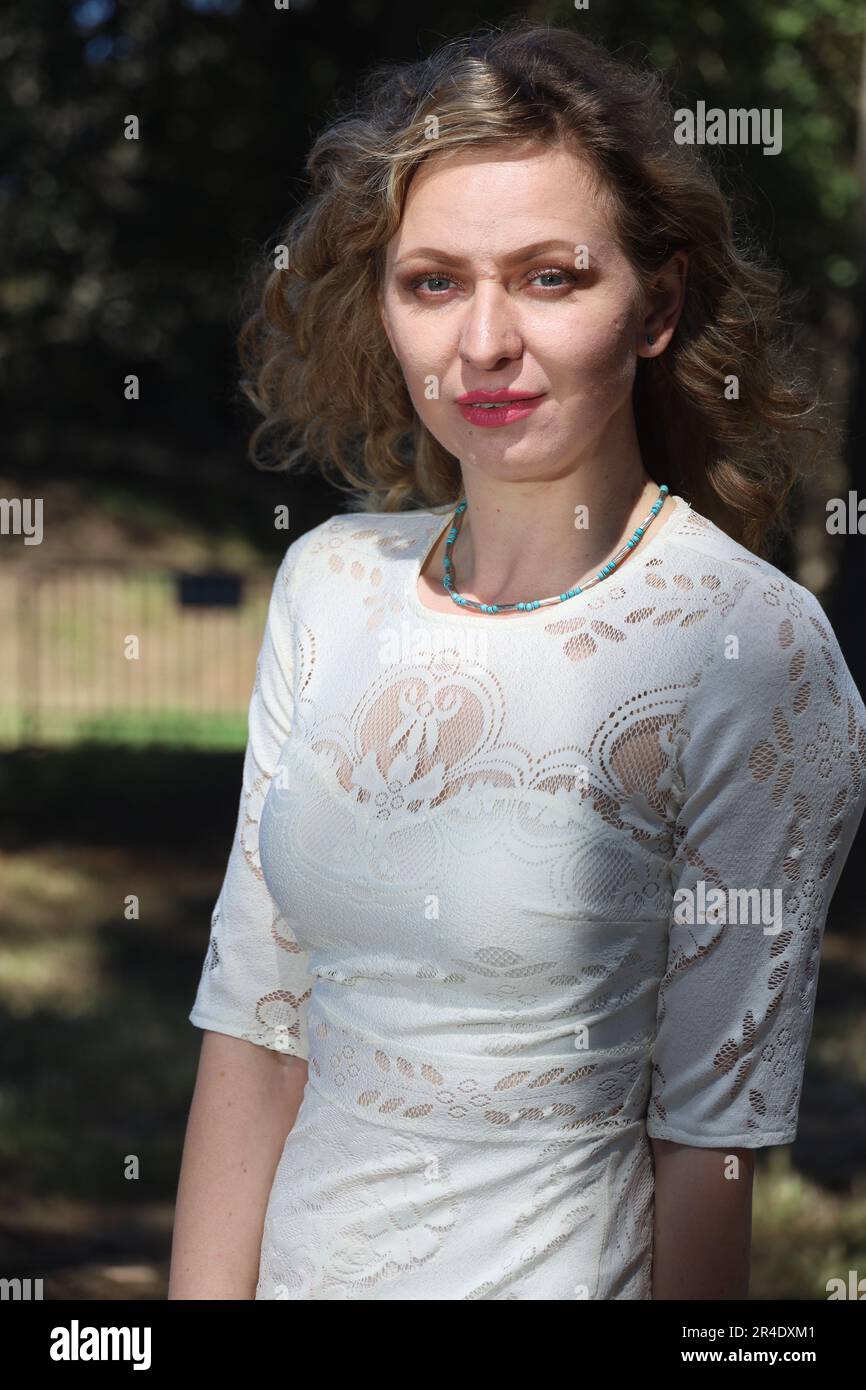 Photo of a Beautiful Russian Lady in a tulip garden by a windmill Stock ...
