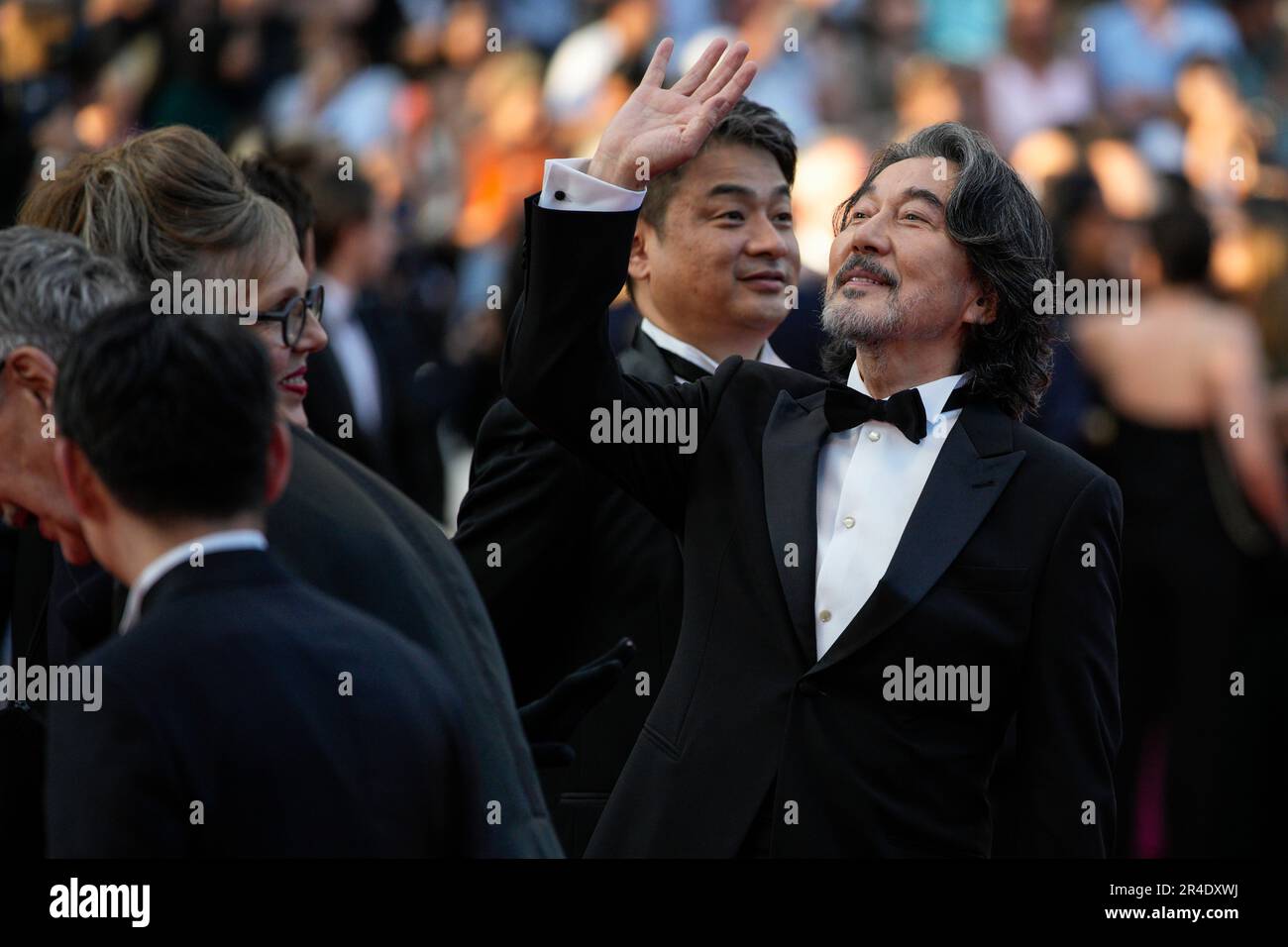 Koji Yakusho, right, poses for photographers upon arrival at the awards ...