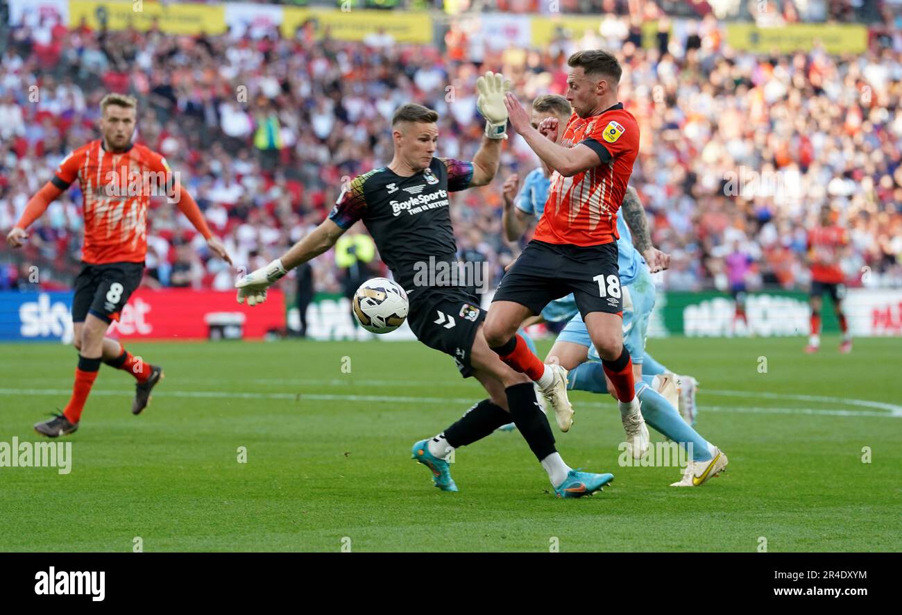 Luton Town's Jordan Clark goes to ground after a challenge by Coventry ...