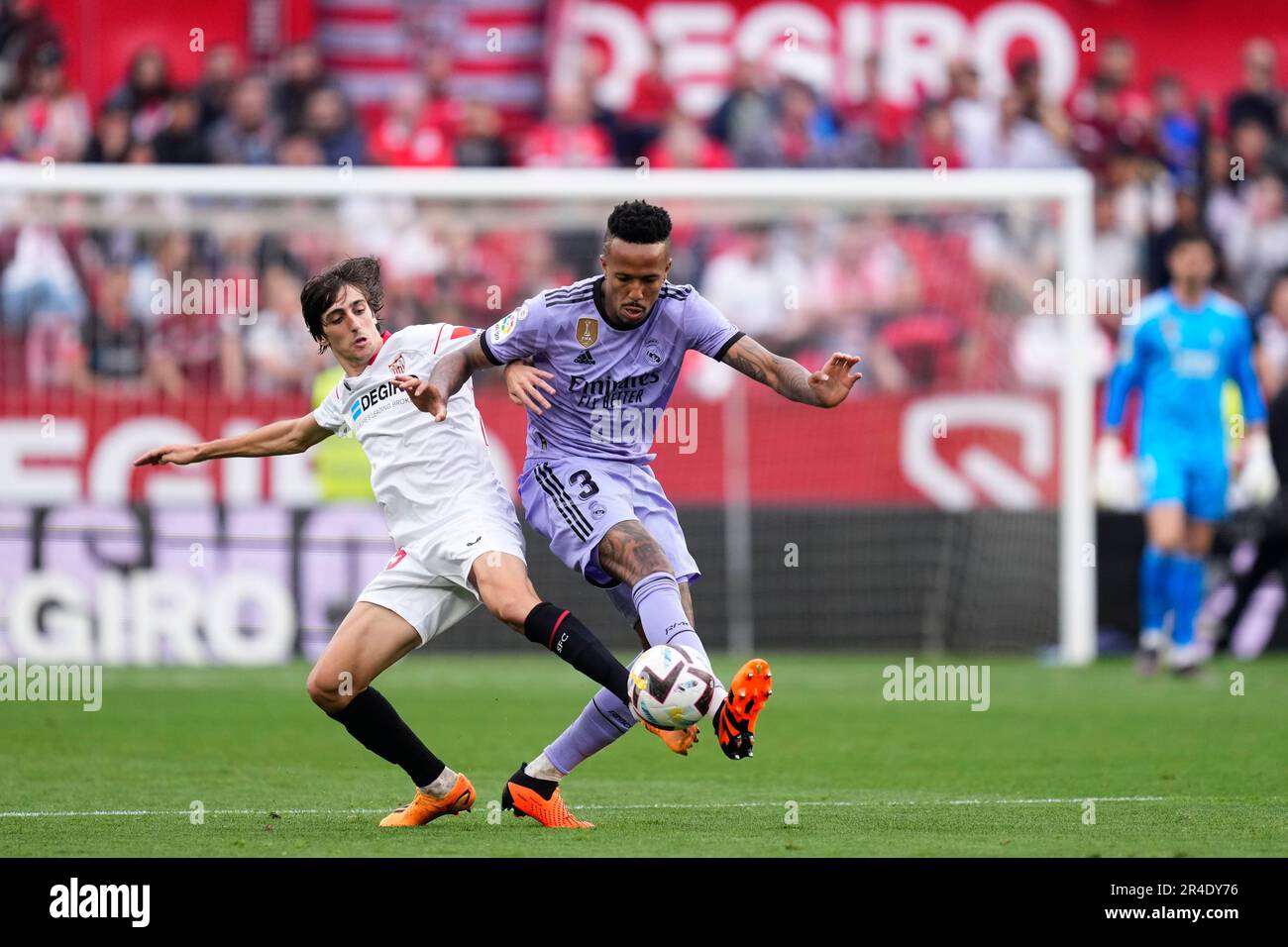 Sevilla's Bryan Gil, left, challenges for the ball with Real Madrid's ...
