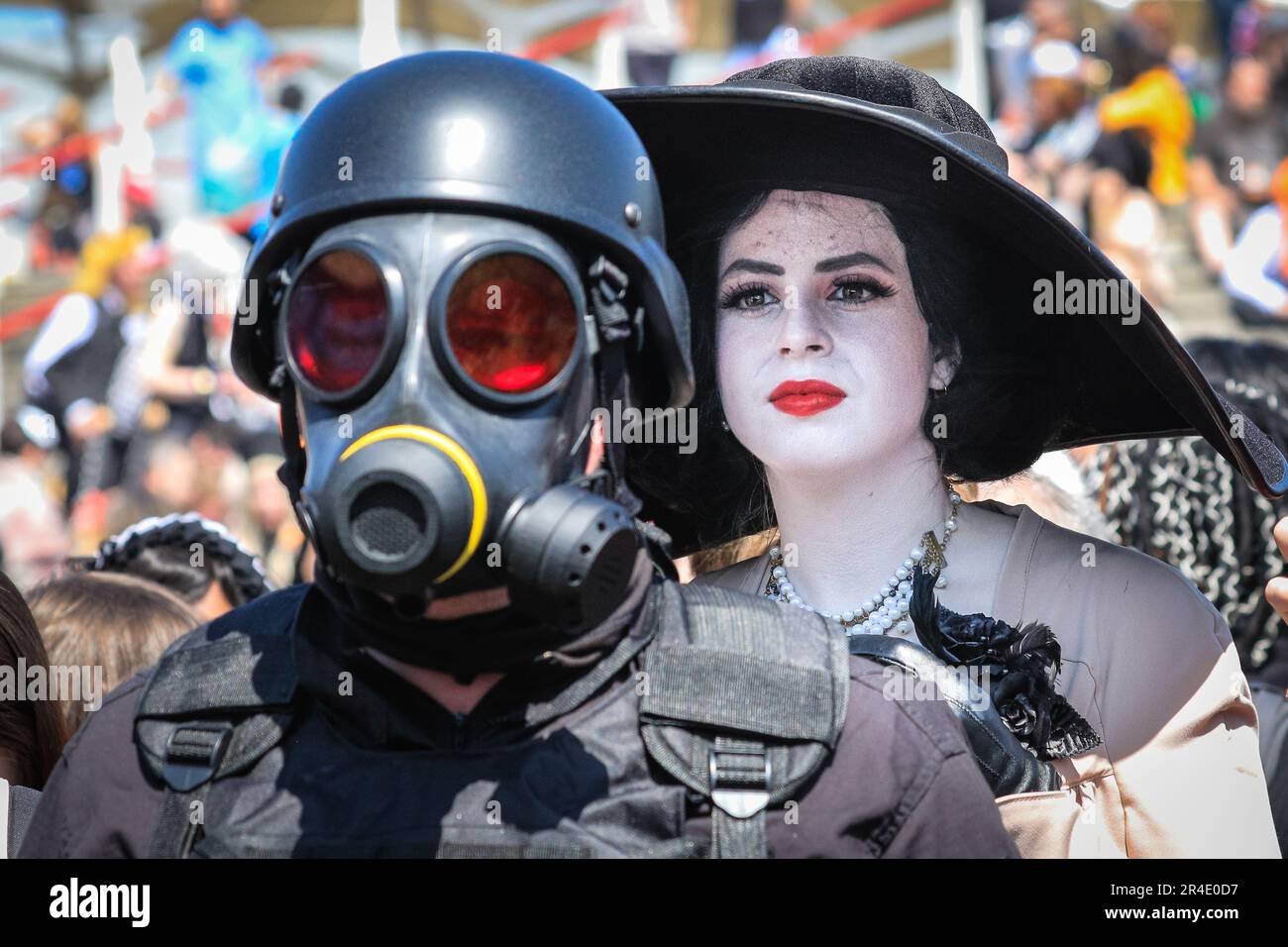 London, UK. 27th May, 2023. Two visitors in very contrasting outfits ...