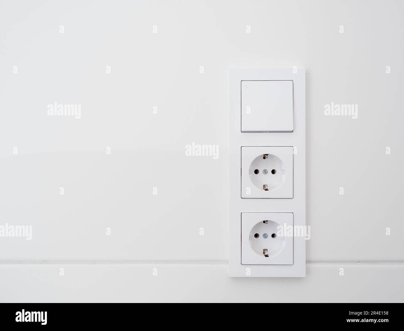 Modern sockets in the wall. European sockets Stock Photo - Alamy