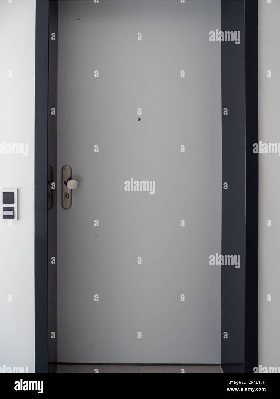 Entrance door to the apartment. Door with peephole Stock Photo - Alamy