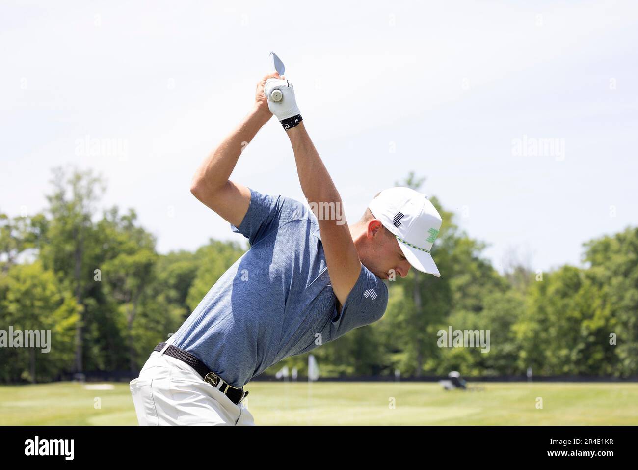 David Puig of Torque GC plays a shot on the driving range during the ...
