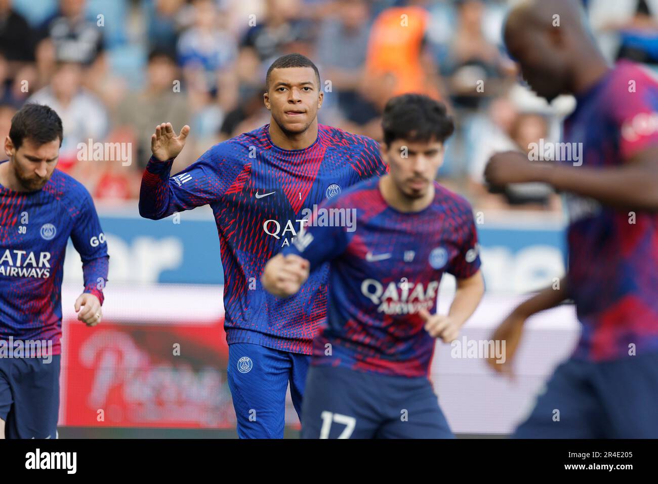 PSG's Kylian Mbappe, centre, warms up prior to the French League One ...