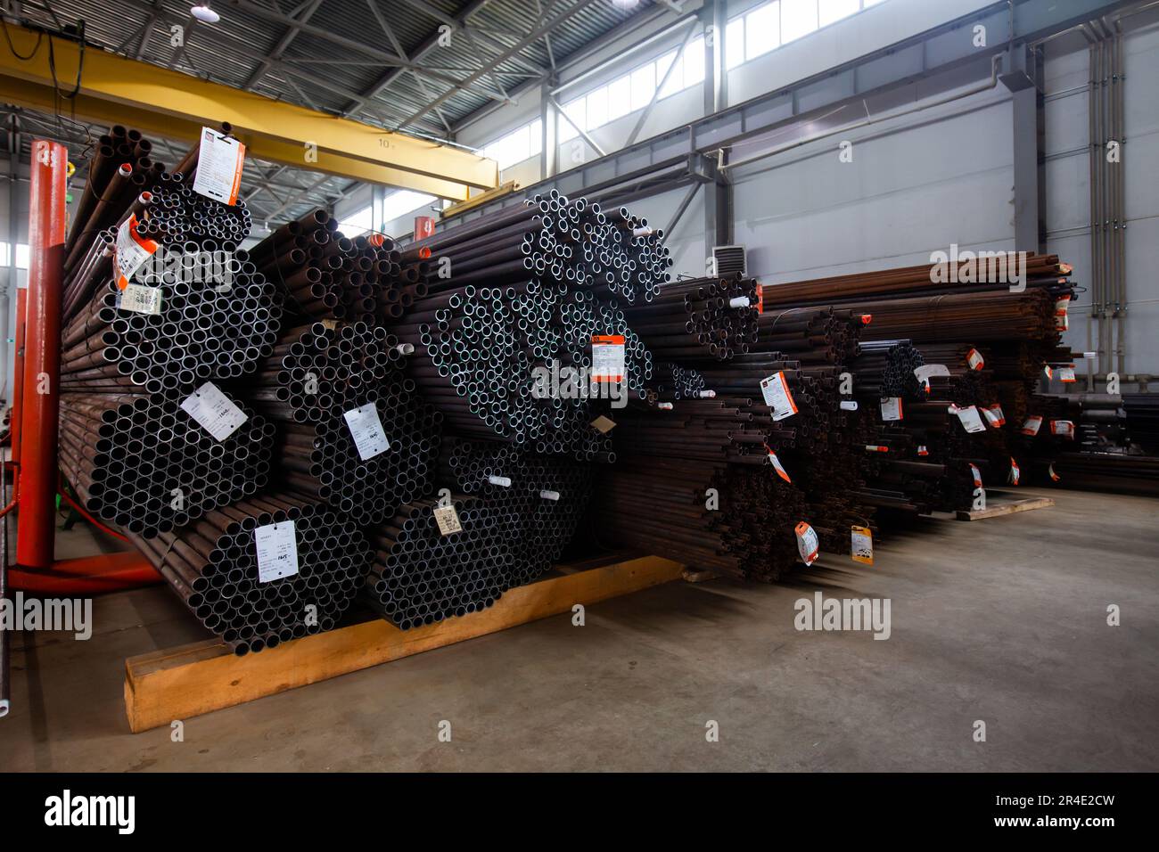 Pipes and tubes indoor warehouse in hangar Stock Photo - Alamy
