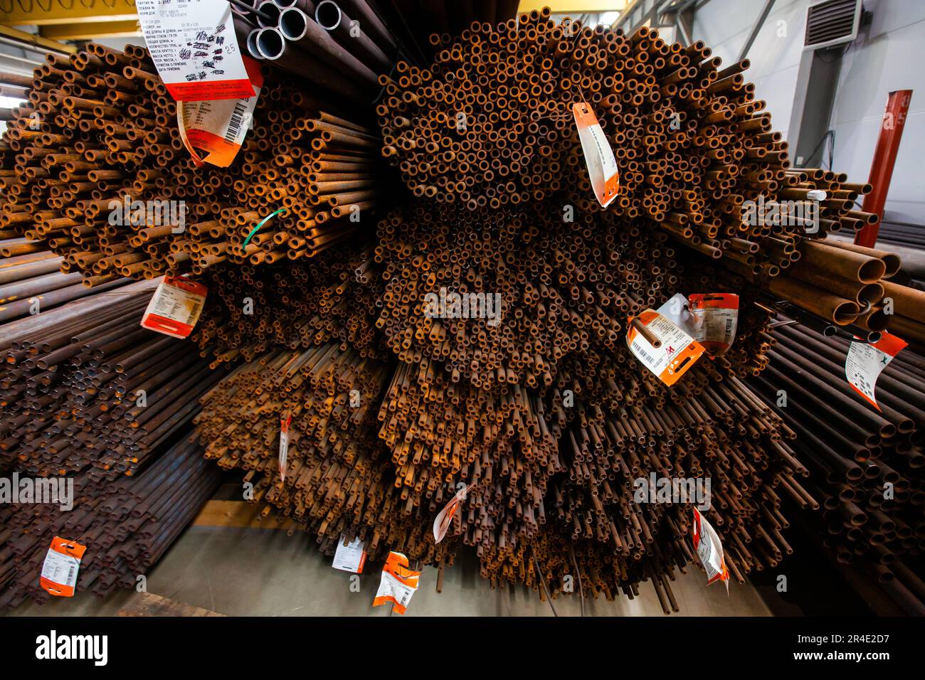 Rusted pipes store in hangar warehouse Stock Photo - Alamy