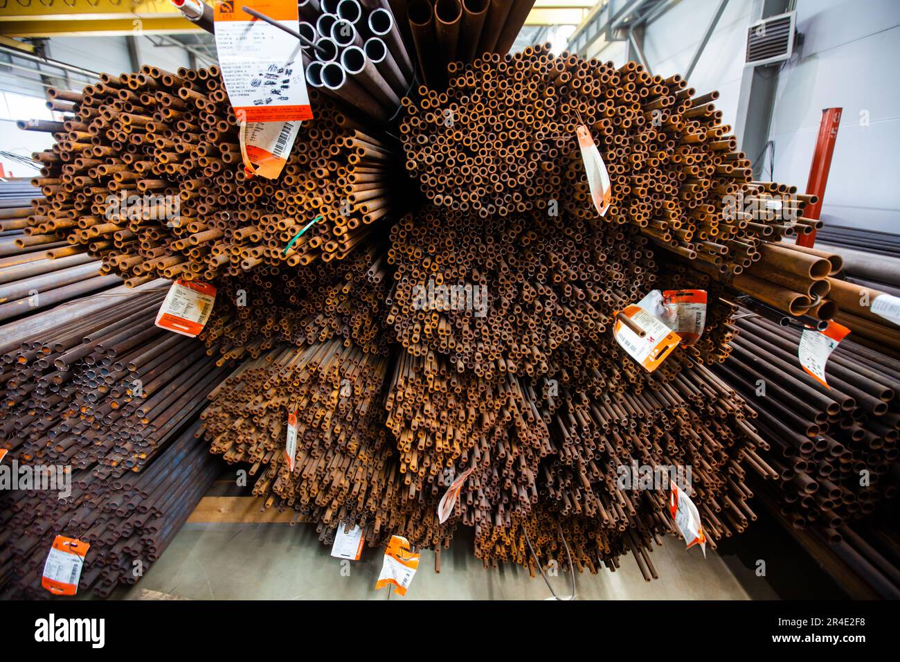 Pipes and tubes indoor warehouse in hangar Stock Photo - Alamy