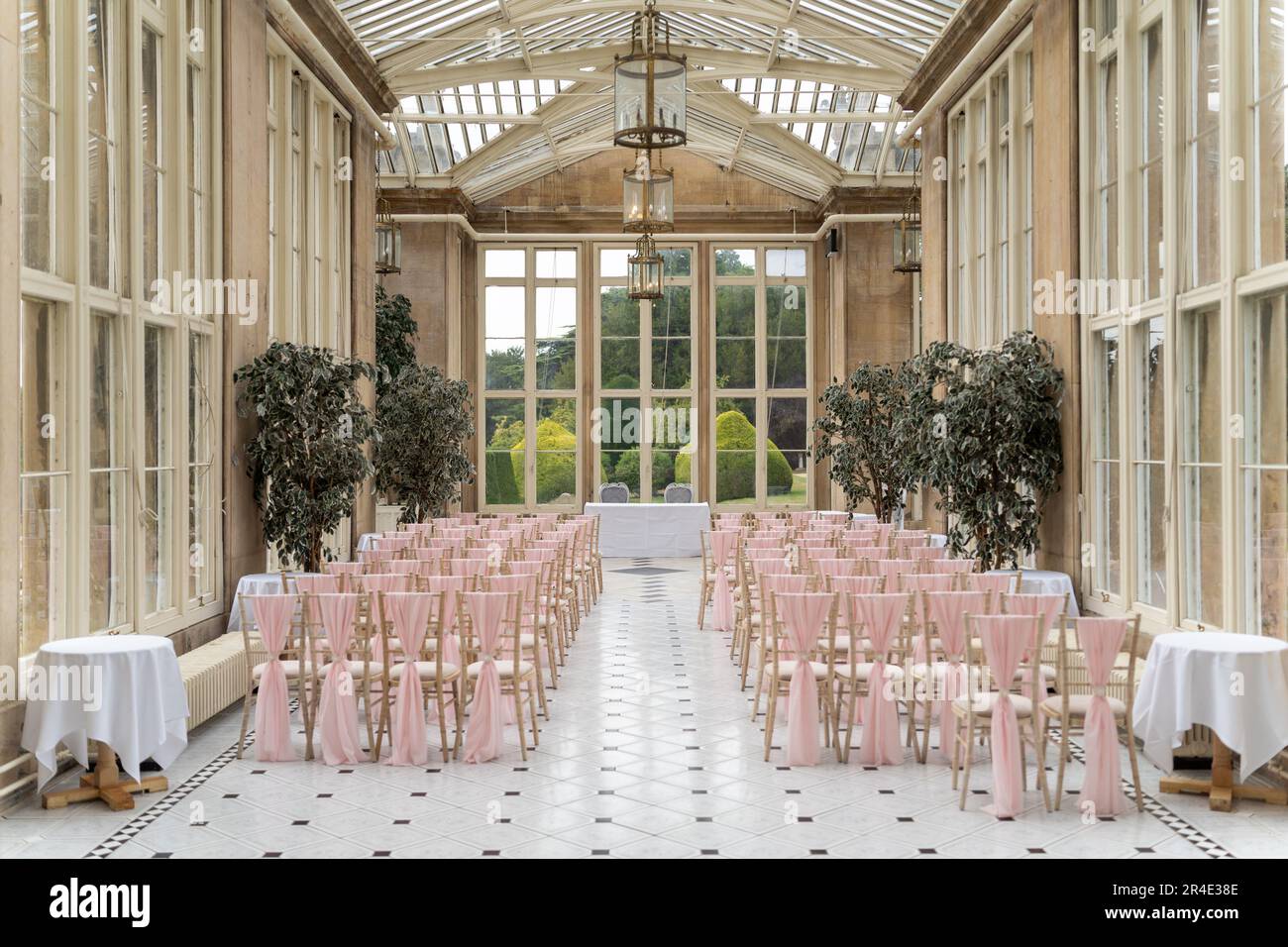 This image features an interior banquet room with elegant tables and ...