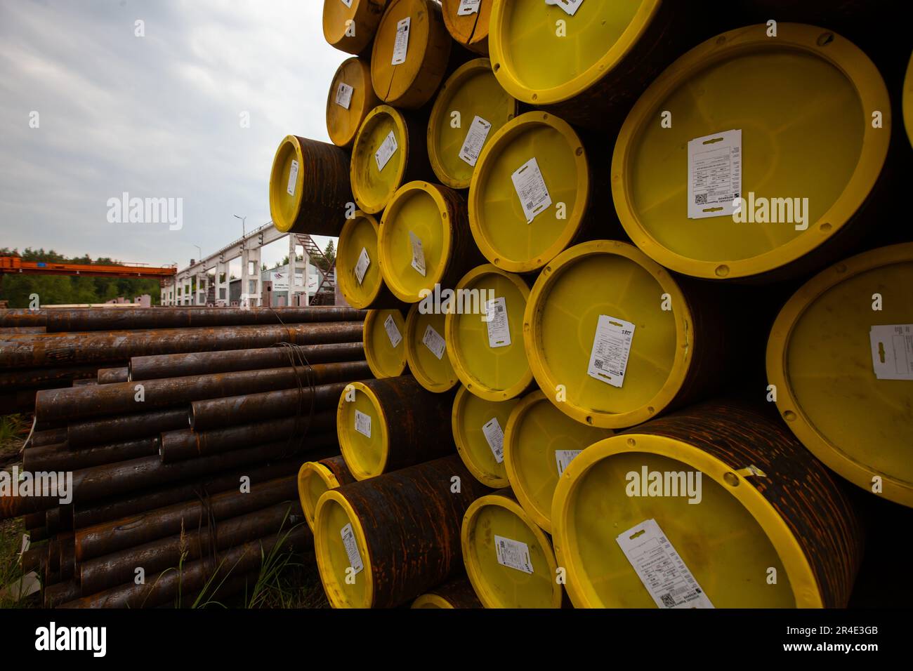Steel pipes with yellow plastic caps, wide-angled distort view Stock ...