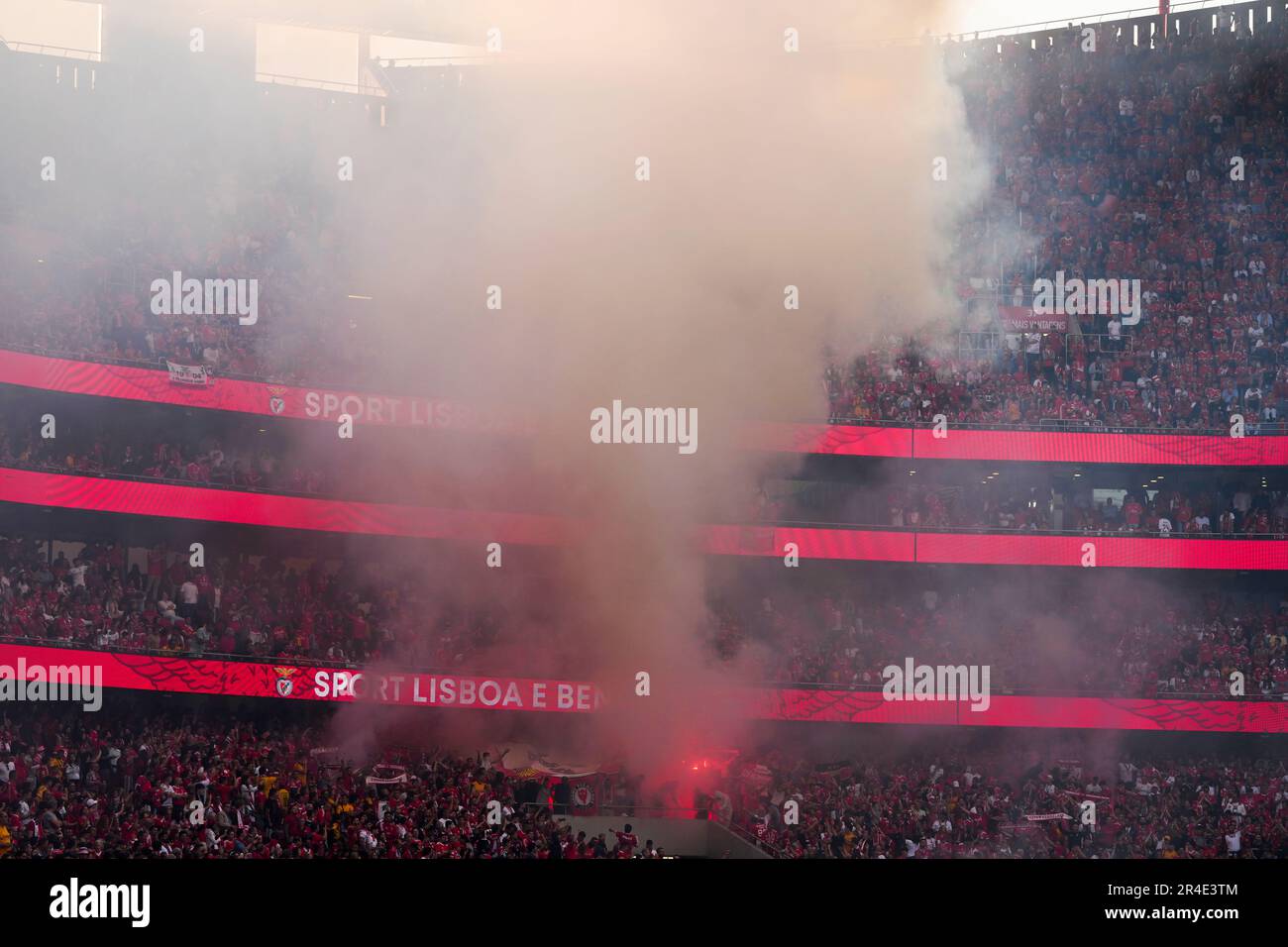 Smokes rises as Benfica supporters burn flares during the Portuguese ...