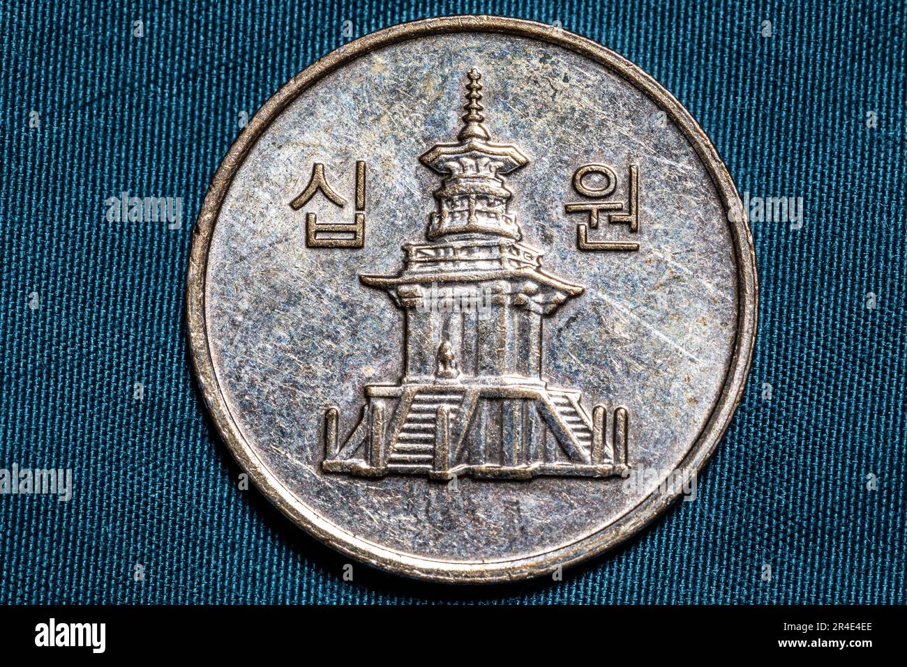 A close-up of a South Korean coin on a blue background Stock Photo - Alamy