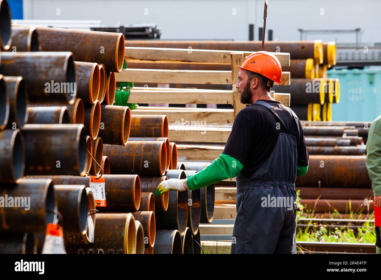 Podolsk, Moscow province - August 02, 2021: Pipes warehouse. Worker on ...