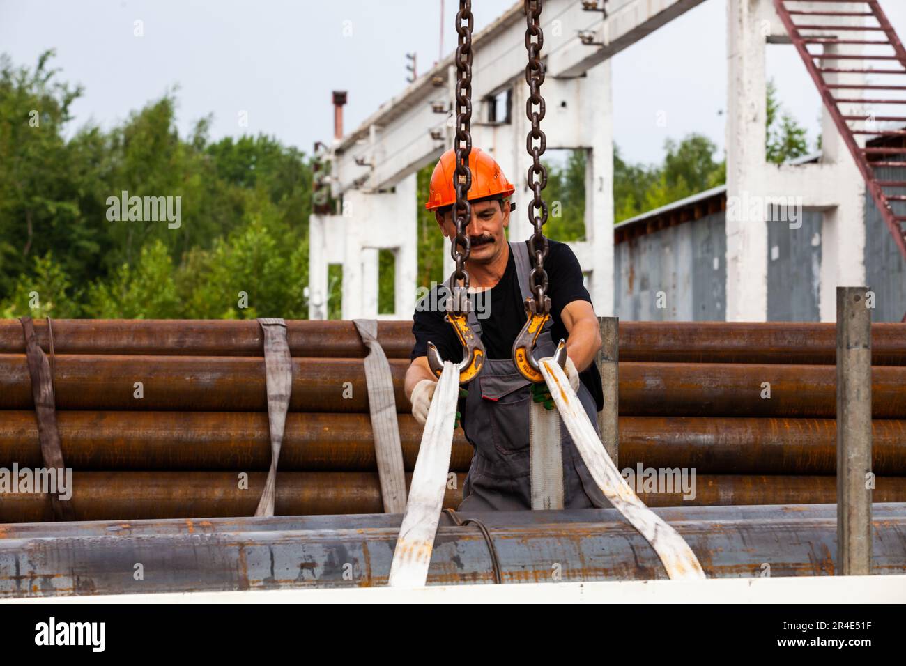 Podolsk, Moscow province - August 02, 2021: Pipes warehouse. Worker ...