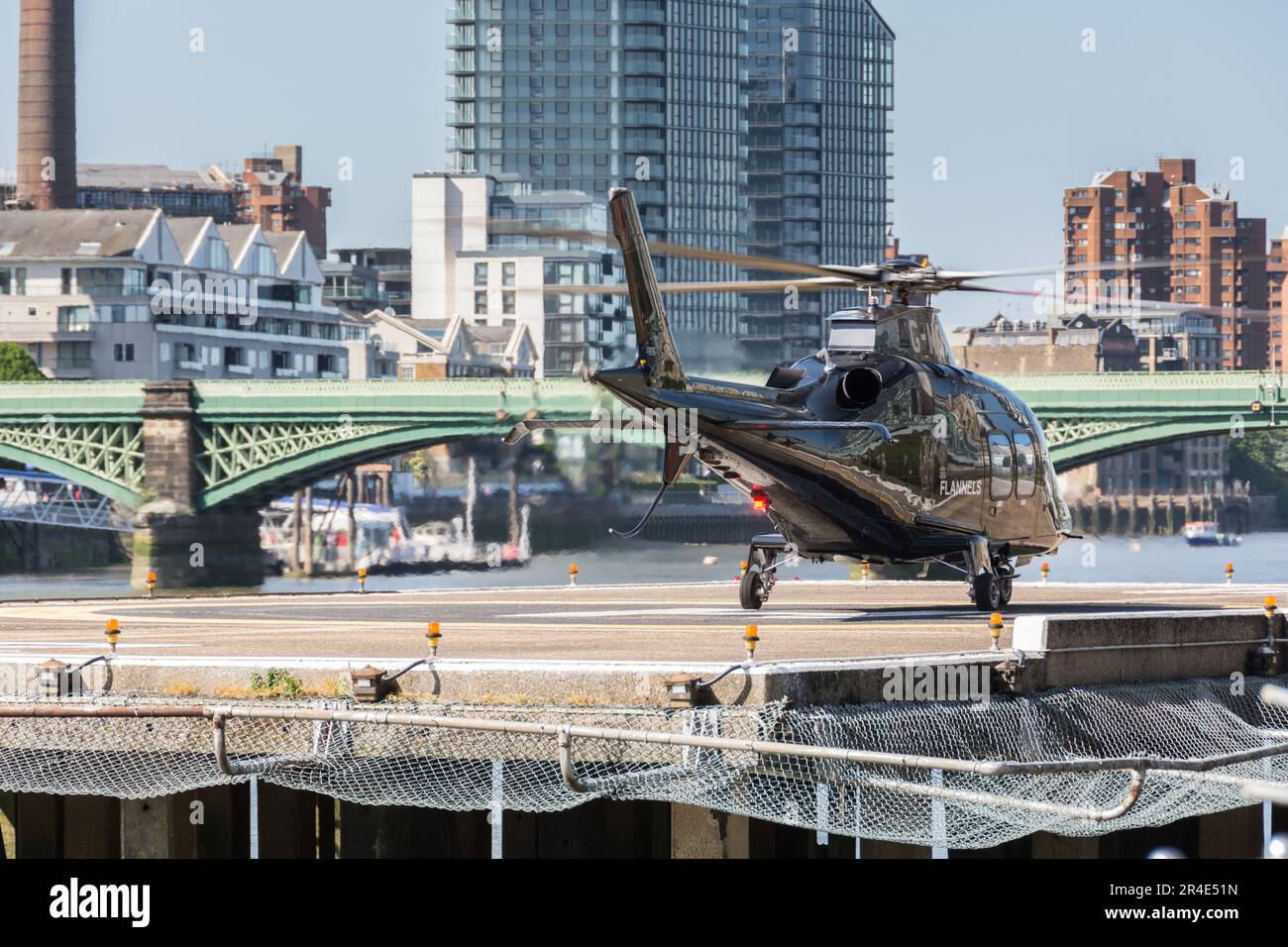 A helicopter landing at London Heliport, Lombard Road, Battersea ...