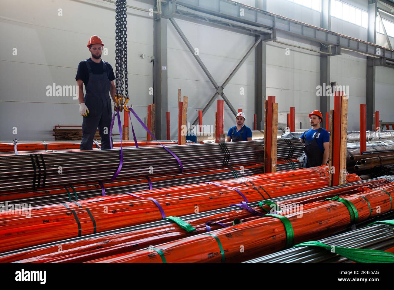 Podolsk, Moscow province - August 02, 2021: Pipes warehouse. Workers on ...