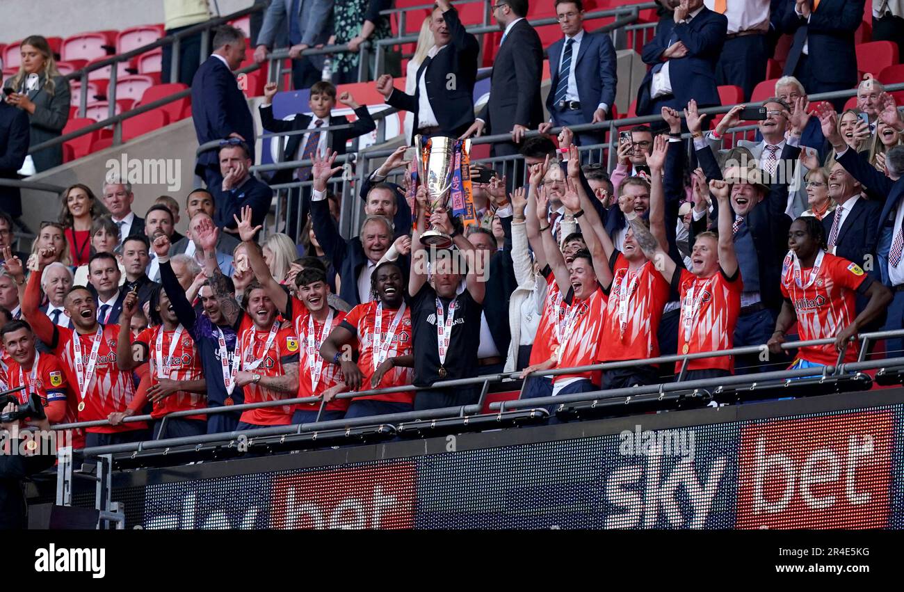 Luton Town manager Rob Edwards lifts the trophy after victory during ...