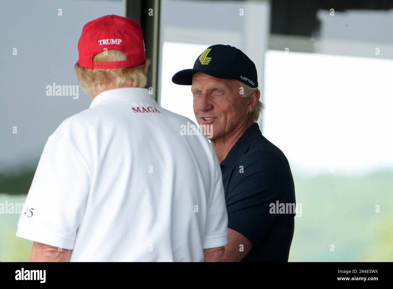 Former President Donald Trump talks with Greg Norman, LIV Golf CEO ...