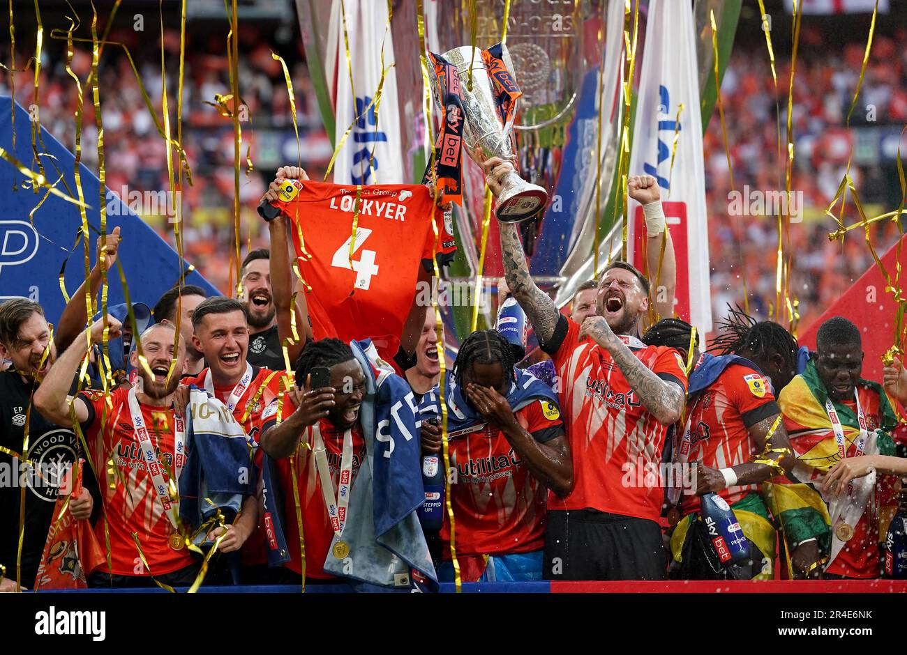 Luton Town’s Sonny Bradley lifts the trophy after their sides victory ...