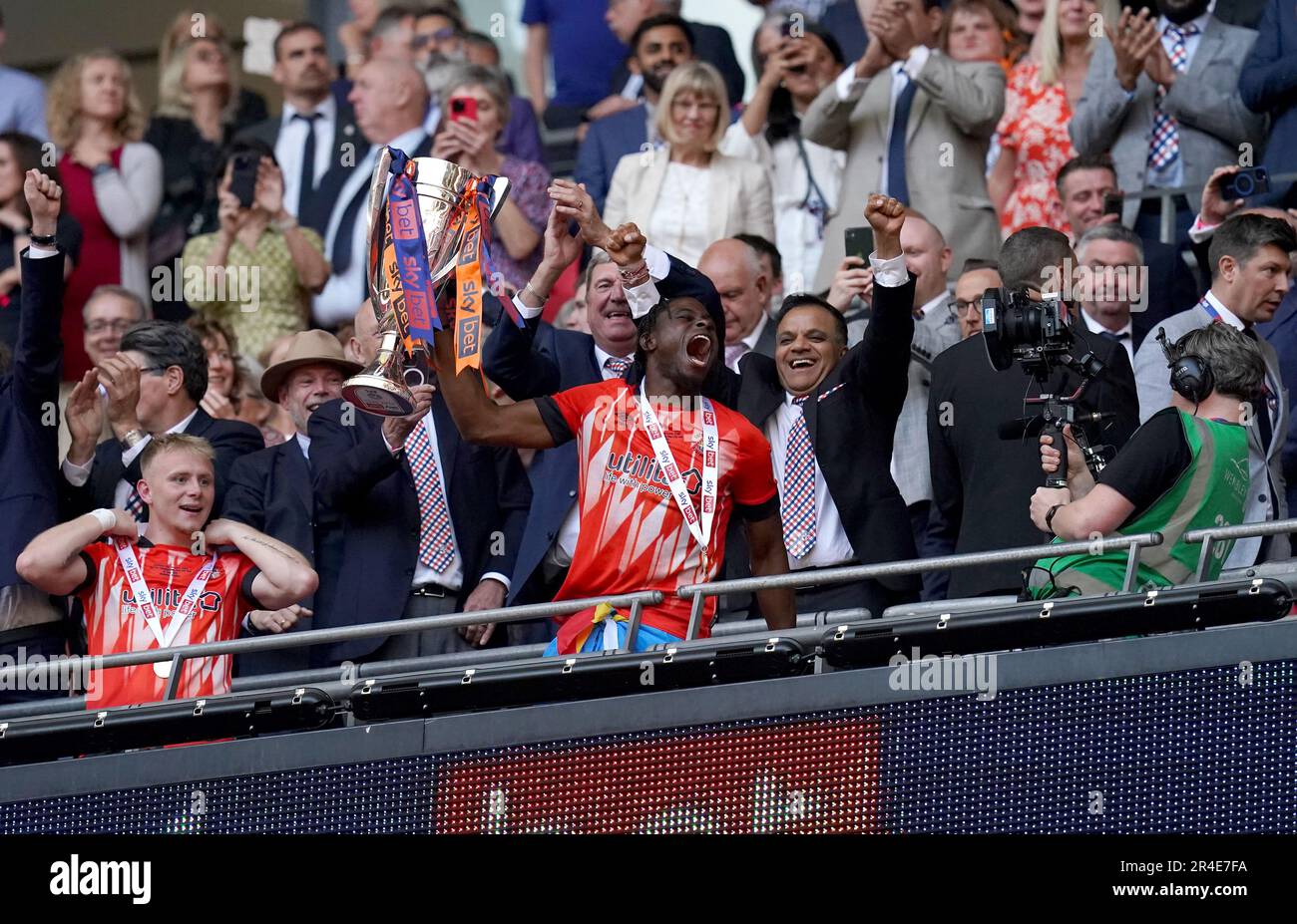 Luton Town's Pelly Ruddock Mpanzu lifts the trophy after winning ...