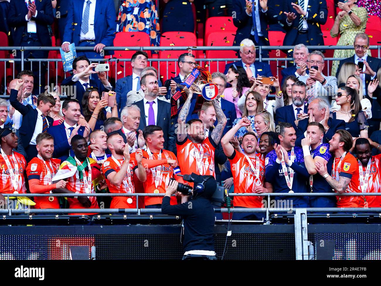 Luton Town's Sonny Bradley lifts the trophy after their sides victory ...