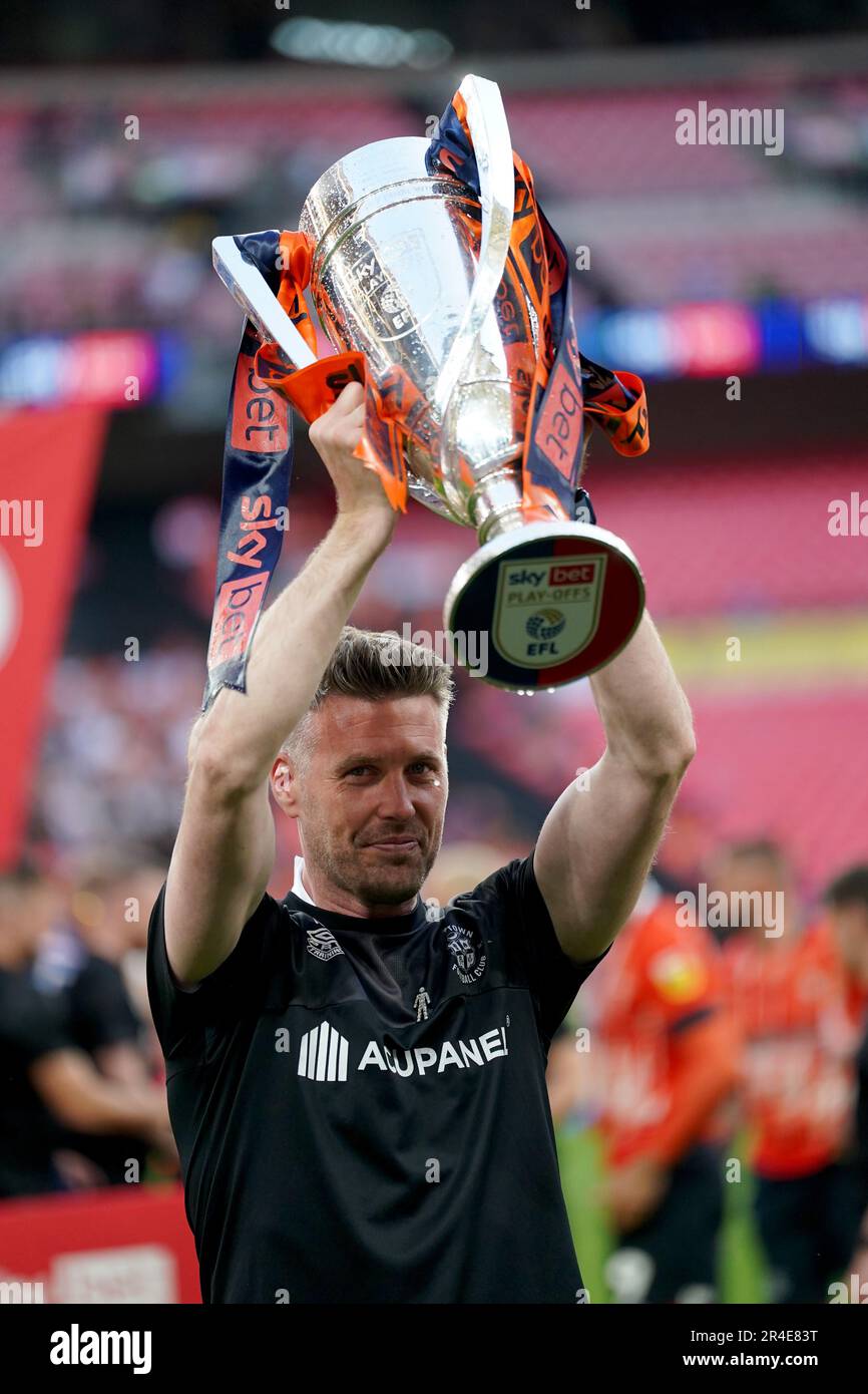 Luton Town manager Rob Edwards poses with their trophy following ...