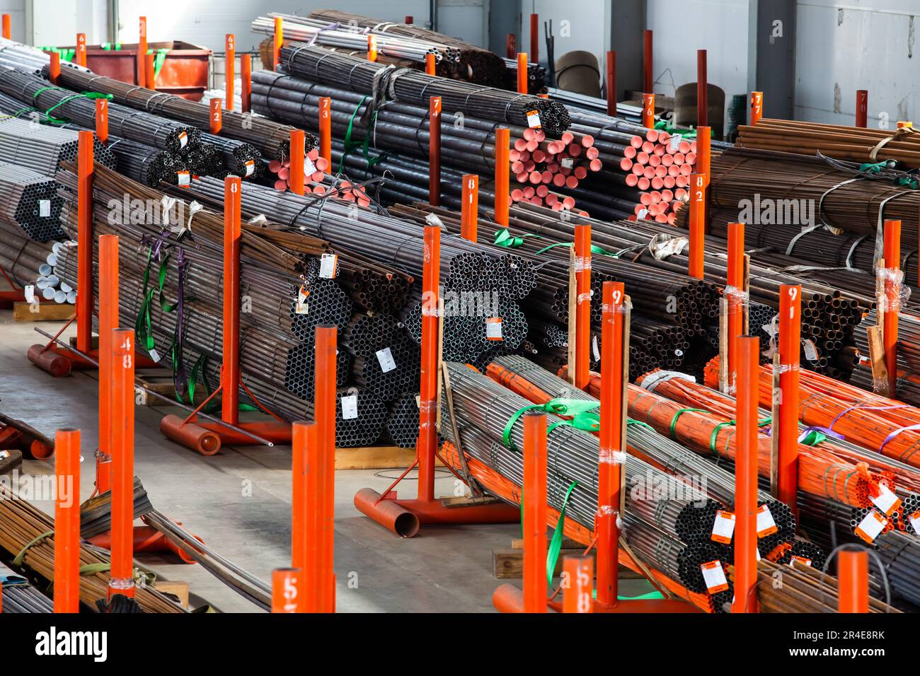 Pipes and tubes warehouse in hangar Stock Photo - Alamy