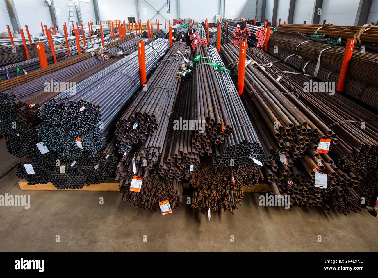 Pipes and tubes indoor warehouse in hangar Stock Photo - Alamy