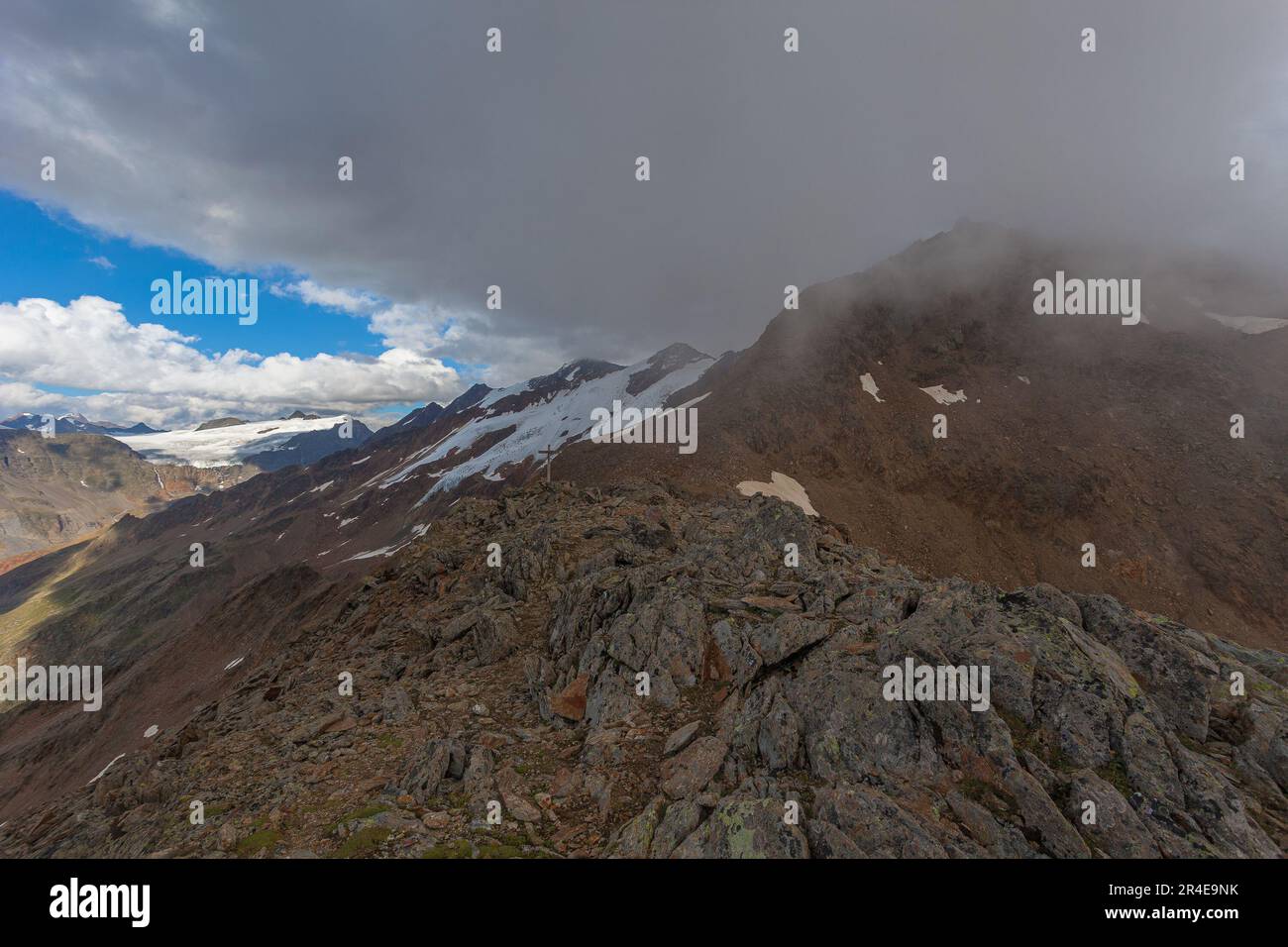 High mountain pass with glaciers and peaks under the clouds, Alto Adige ...