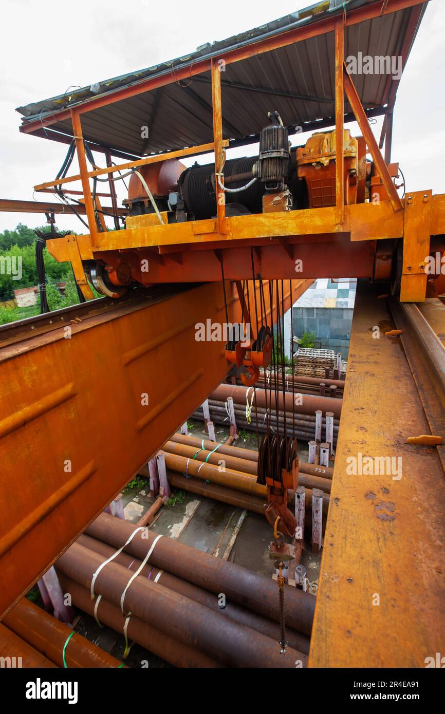 Crane lifting pipes hi-res stock photography and images - Alamy