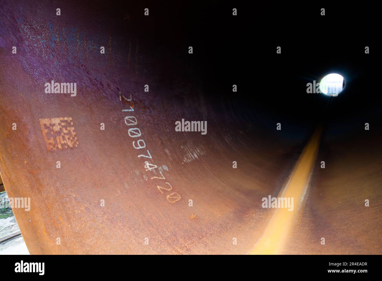 Marking of steel tubes. Close-up photo of printed QR-code and numbers ...