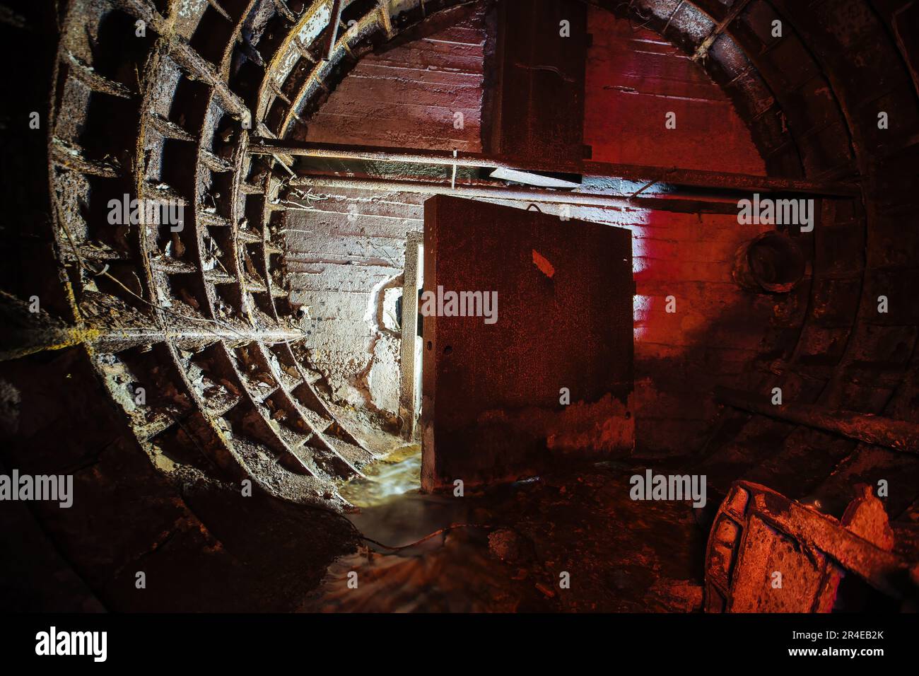 Old rusty abandoned round bunker with armored door Stock Photo - Alamy