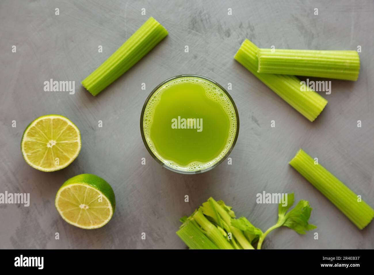Refreshing Organic Celery Juice with Lime in a Glass, top view. Flat ...