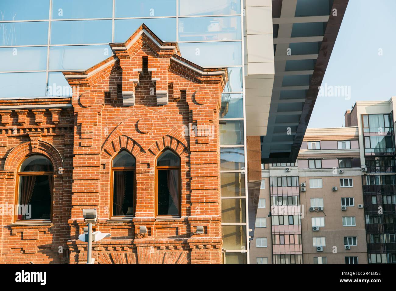 Architecture contrast old house and a new modern building Stock Photo ...