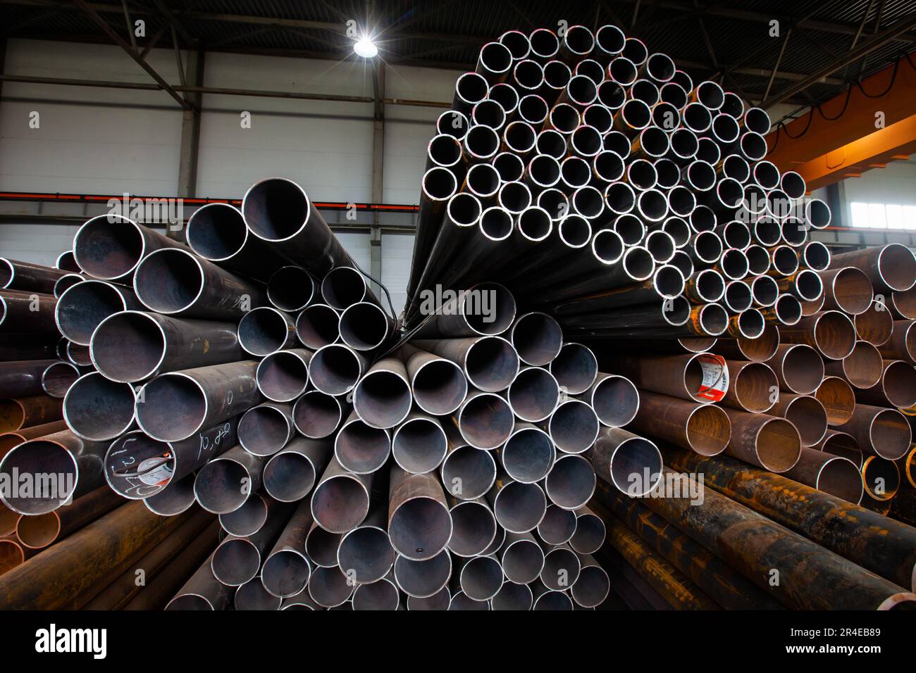 Steel pipes and tubes on warehouse Stock Photo - Alamy