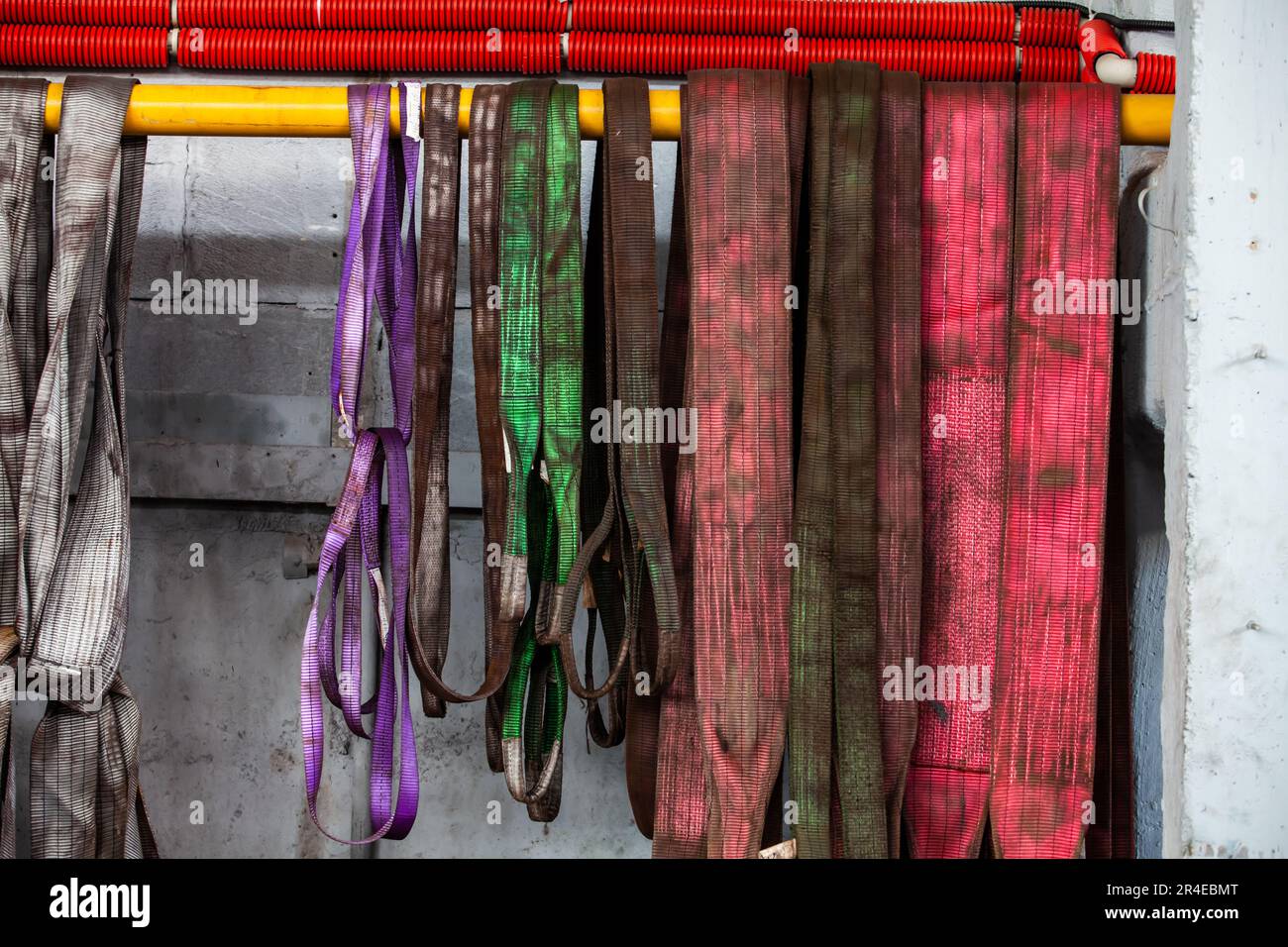 Metal machining plant. Color weight lifting belts (straps Stock Photo ...