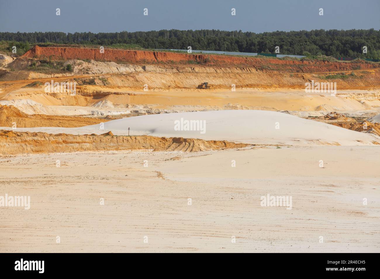 View on white sand quarry. open-pit extraction. forest and blue sky on ...
