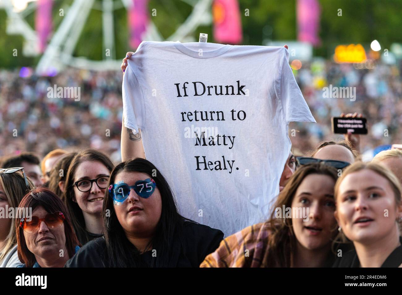 Fans watch The 1975 performing on the main stage during BBC Radio 1's ...