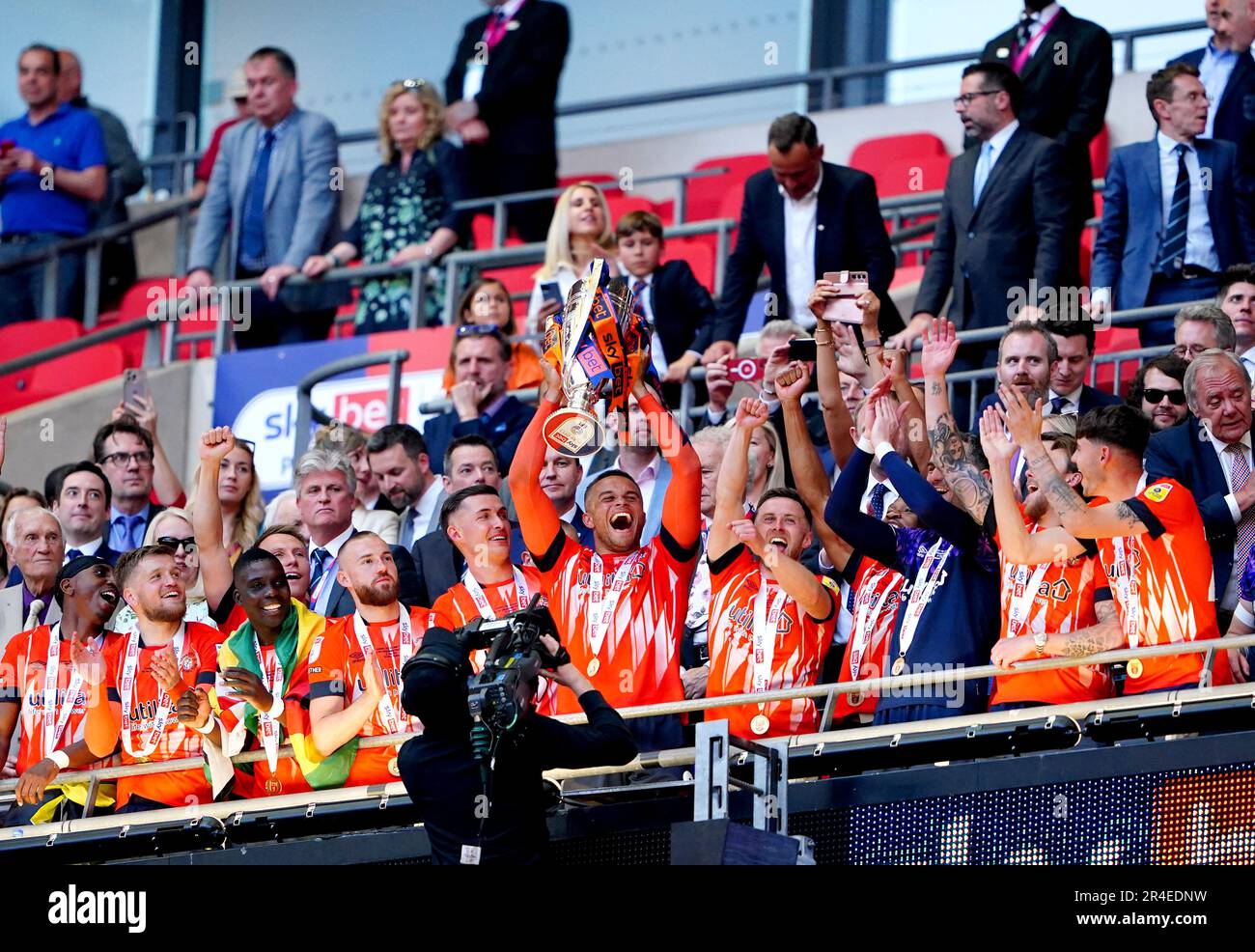 Luton Town's Carlton Morris lifts the trophy as he celebrates their ...