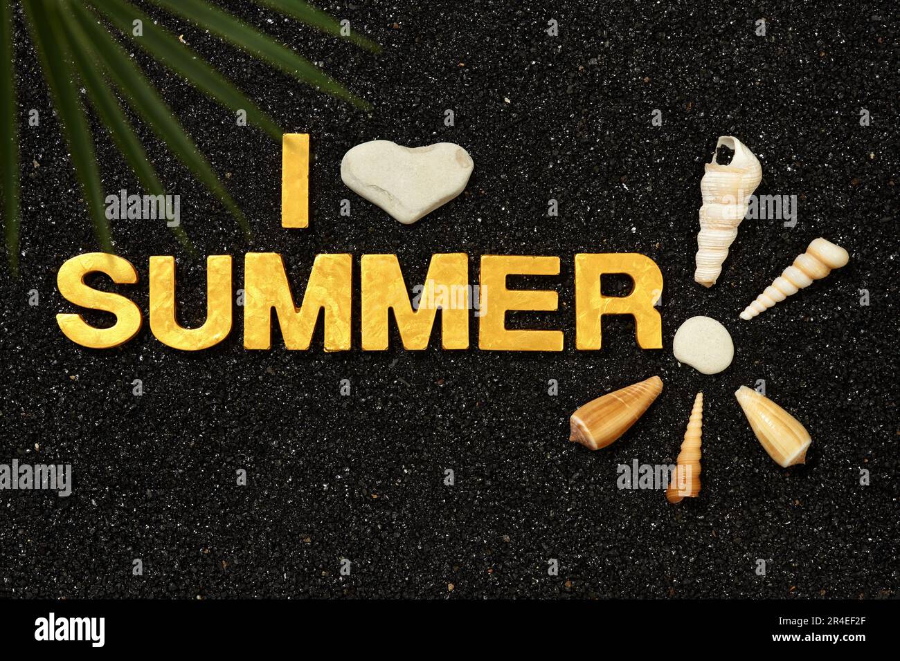 I Love Summer - Text in black beach sand with shells and sea pebbles ...