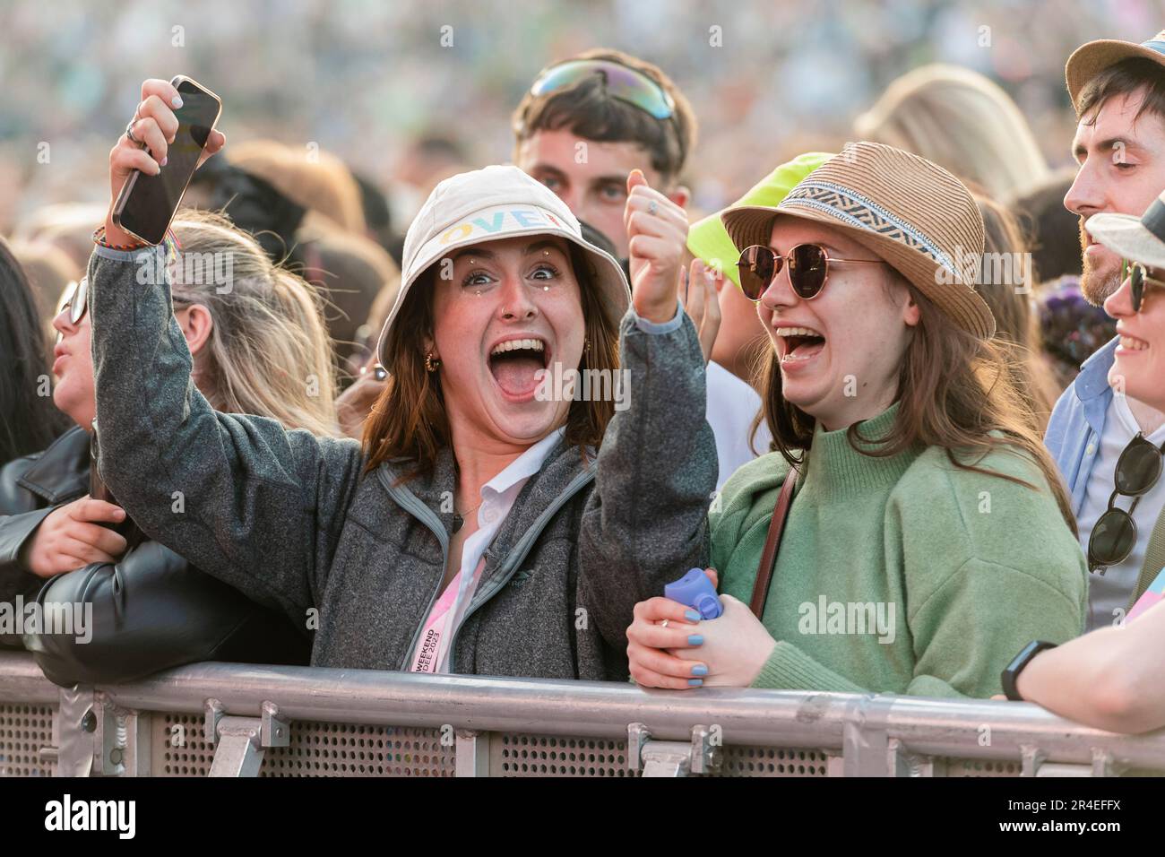 Fans watch The 1975 performing on the main stage during BBC Radio 1's ...