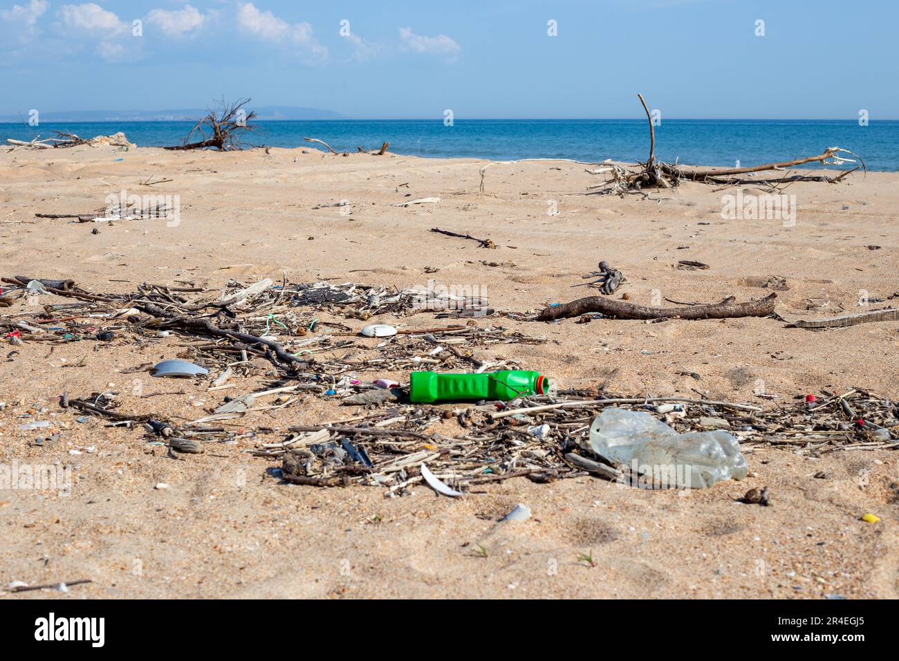 Garbage on the beach. Plastic garbage was carried out by a wave on a ...