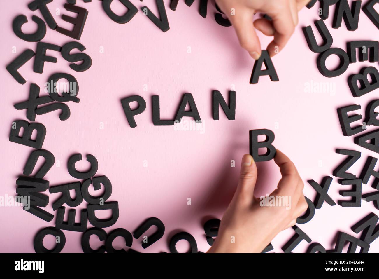 Plan A and plan B, hands replace the letters Stock Photo - Alamy