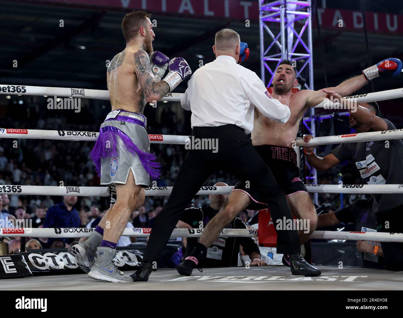 The referee stops the fight after Sam Eggington (left) strikes Joe ...