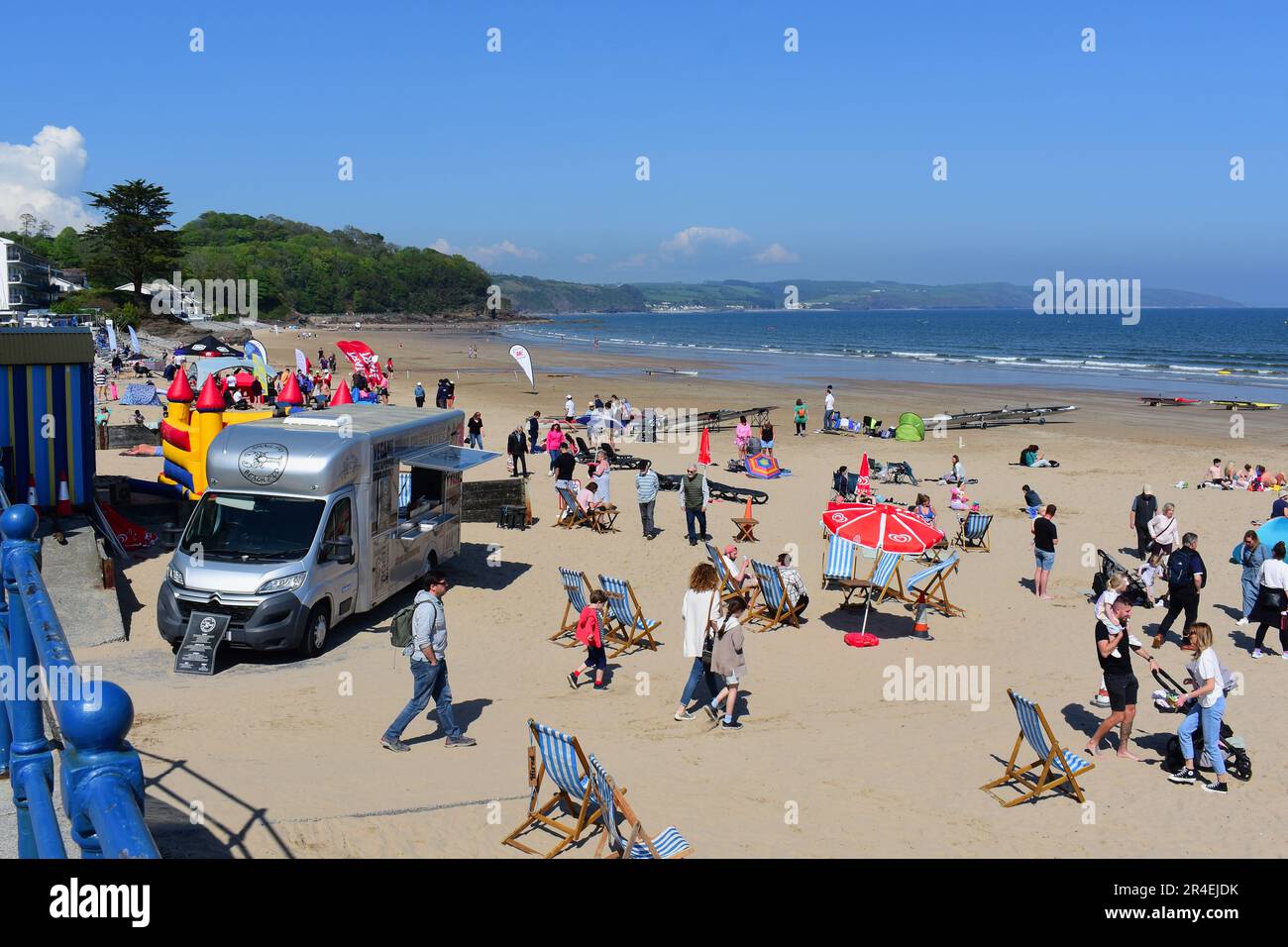A typical busy British seaside holiday scene at the beach in summer in ...