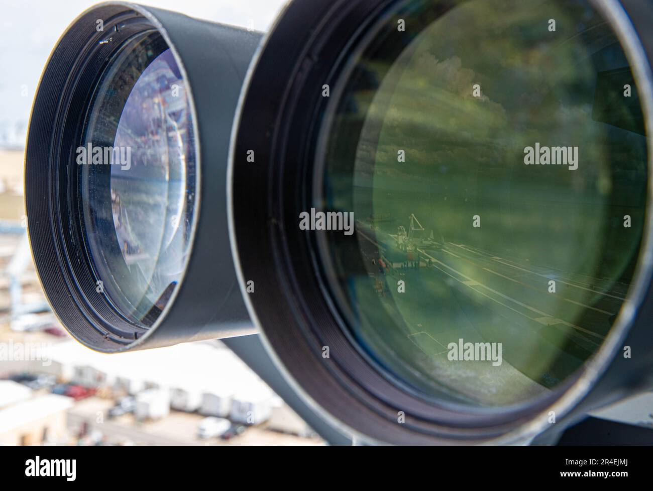 Flight deck seen from above, reflected by binoculars onboard the Nimitz ...