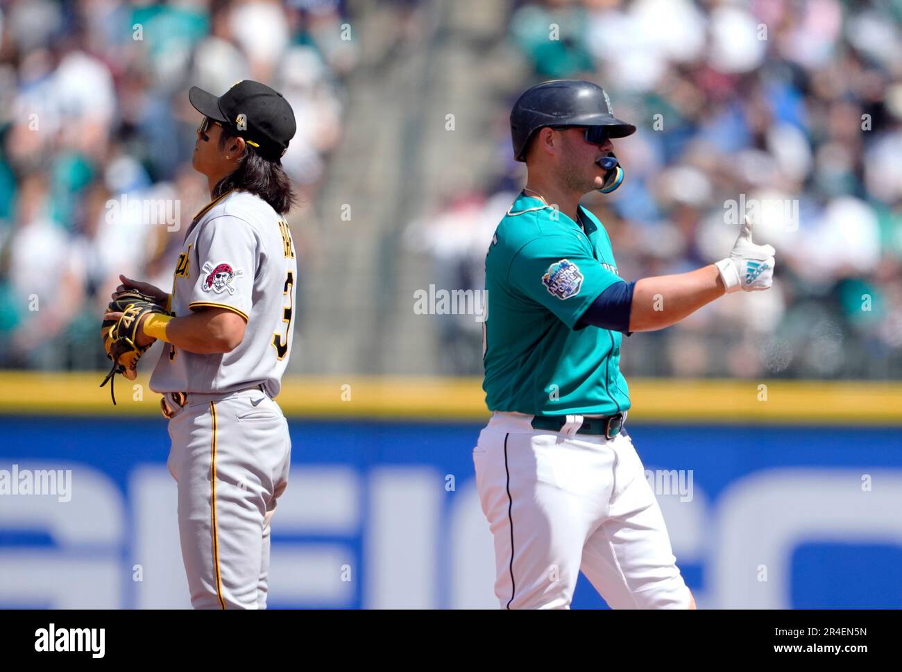 Seattle Mariners' Ty France gives a thumbs up after hitting a double as ...