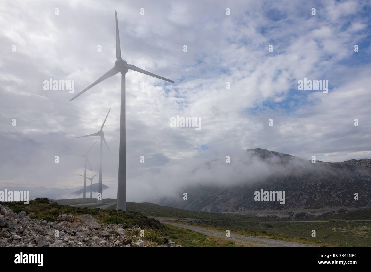 A high-altitude road leads to wind turbines, Greece, Crete Stock Photo ...