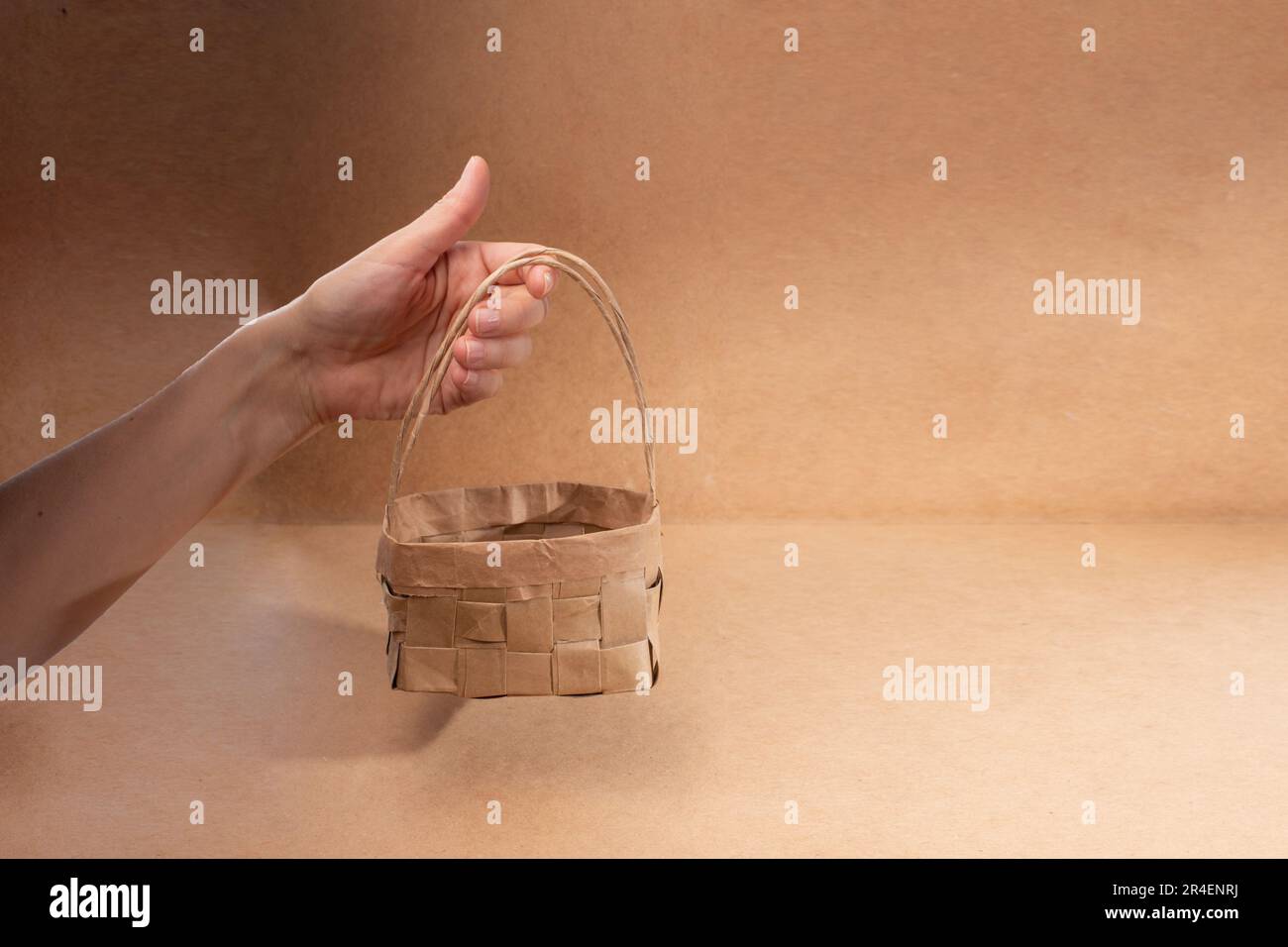 basket paper craft from recycled waste paper bag Stock Photo - Alamy